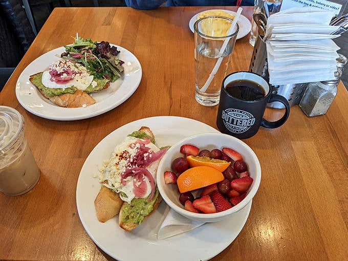 Avocado toast that would make millennials weep with joy, paired with a rainbow of fresh fruit that actually tastes like fruit.