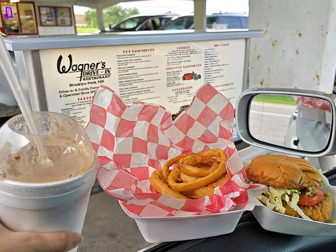 The authentic drive-in experience lives on at Wagner's, where your car becomes your dining room and the dashboard your table.