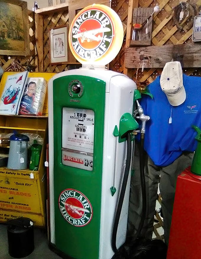 Vintage Sinclair gas pump and automotive memorabilia celebrate America's love affair with the open road, when filling up meant full service and gas stations had genuine personality.