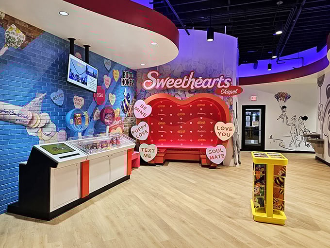 The Sweethearts Chapel's heart-shaped bench offers a perfect photo opportunity surrounded by candy conversation hearts that speak the universal language of love.