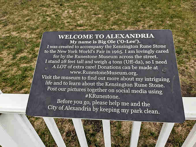 The informational plaque introduces visitors to "Big Ole (O-Lee)," explaining his journey from the 1965 World's Fair to becoming Alexandria's beloved 4-ton guardian.
