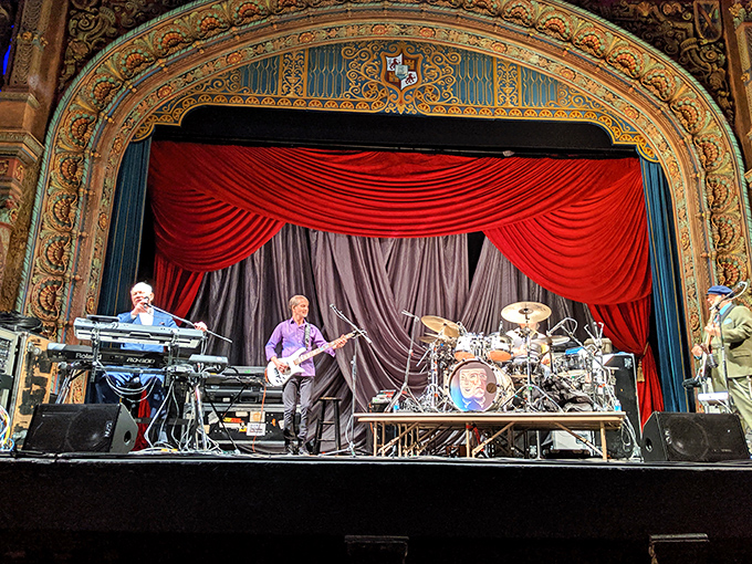 Live performances bring the historic stage to life, proving this venue's versatility as both cinema and concert hall.