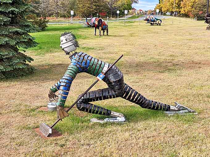 Nature meets machinery in this peaceful scene where metal creatures coexist in a grassy gallery, each telling its own story of creative transformation.