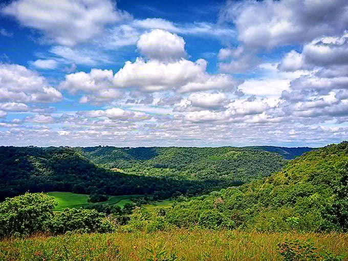 Rolling hills stretch to the horizon under a cloud-scattered sky &ndash; the kind of view that makes smartphone cameras seem woefully inadequate.