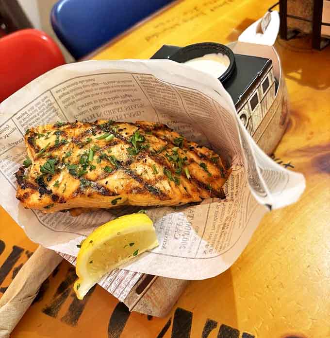This grilled salmon isn't just cooked, it's serenaded to perfection, flaking apart with the gentlest nudge of your fork.