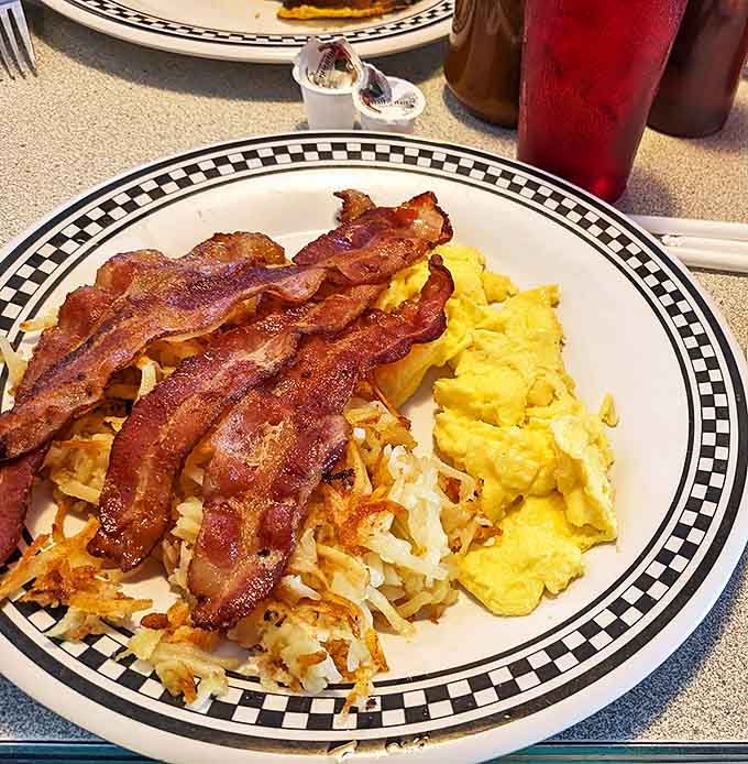 Breakfast of champions &ndash; golden scrambled eggs, perfectly crisped bacon, and hash browns that strike that magical balance between crispy and tender.