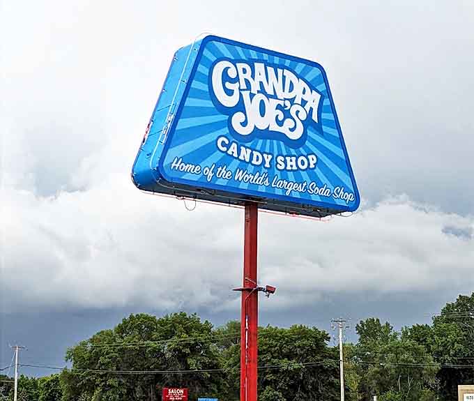 The illuminated sign glows like a beacon in the night, guiding sugar-seekers to their sweet destiny.