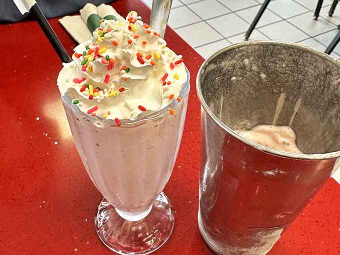 Strawberry shakes topped with whipped cream and rainbow sprinkles &ndash; thick enough to require serious straw strength and determination.