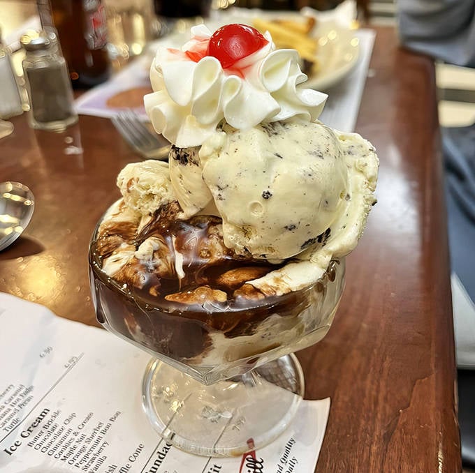This isn't just dessert &ndash; it's a structural marvel of ice cream, hot fudge, and whipped cream that demands to be photographed before devoured.