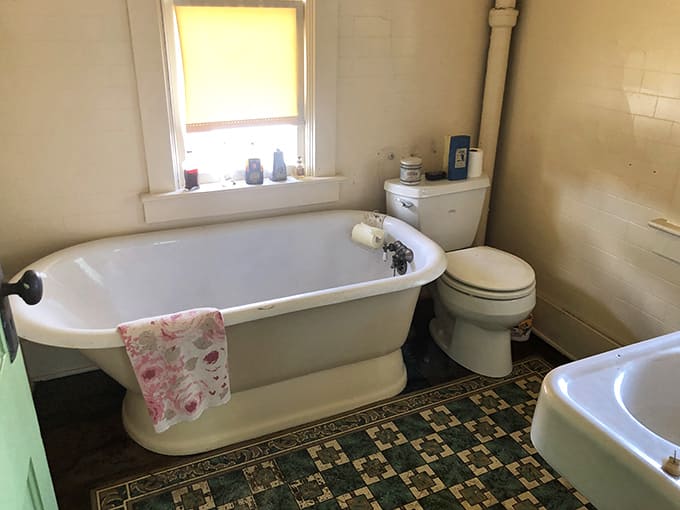 The clawfoot tub and simple fixtures remind us of morning rituals before endless bathroom products and spa-like experiences became the norm.
