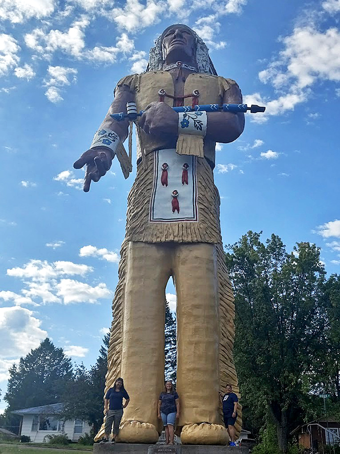 Hiawatha's impressive scale becomes clear when visitors stand at his base. His bright yellow outfit and stoic expression have welcomed travelers to Ironwood since 1964.