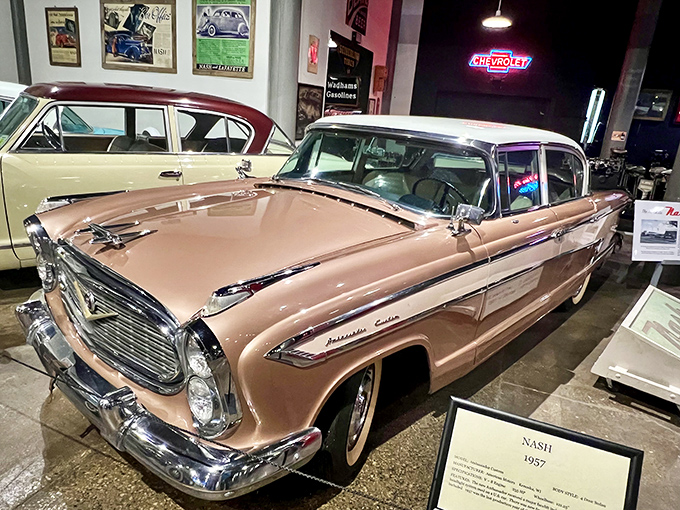 The 1957 Nash Ambassador's salmon-pink elegance screams "I Love Lucy" era &ndash; when cars weren't just transportation but rolling statements of mid-century prosperity.