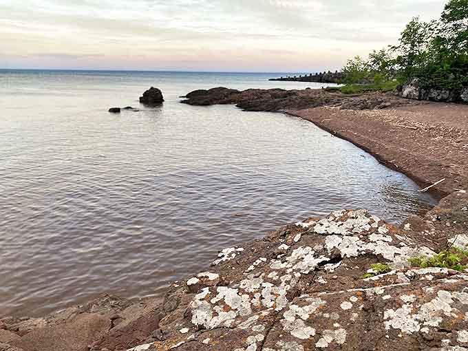 The rocky cove creates a perfect frame for Lake Superior's endless blue horizon.