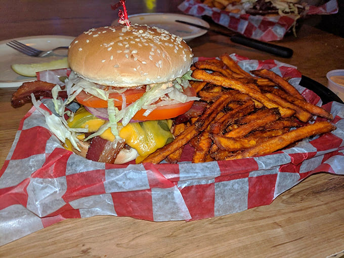 This hand-formed patty topped with melty cheese and crispy bacon demands both hands and zero regrets.