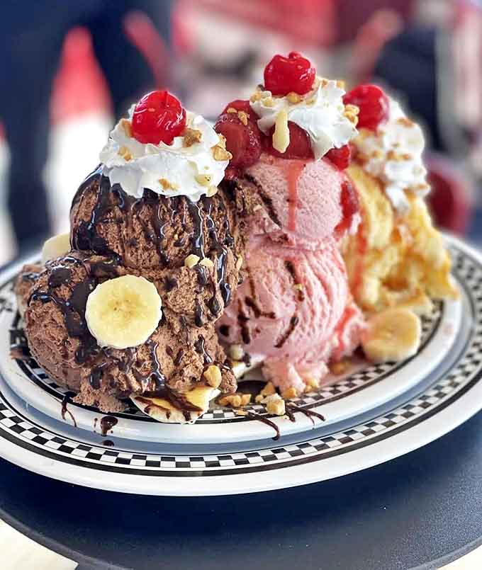 A banana split mountain of ice cream, whipped cream, and cherries that laughs in the face of portion control.