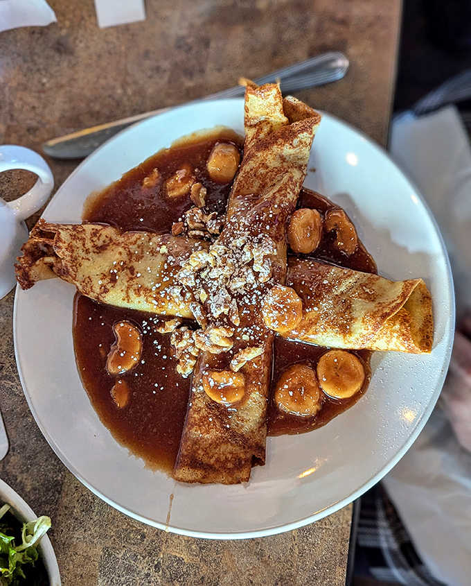 Bananas Foster crepes where thin pancakes meet caramelized bananas in a pool of buttery, cinnamon-spiked sauce. Dessert worth saving room for.