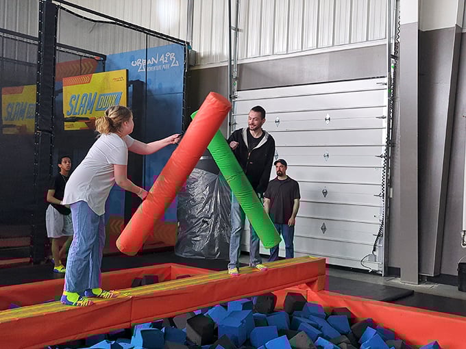 The Battle Beam turns friends into gladiators, where victory means staying dry and defeat means a soft landing in the foam pit below.
