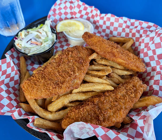 Golden-battered fish rests on a bed of crispy fries, with coleslaw providing the perfect creamy counterpoint &ndash; proof that Betty's savory game is as strong as their sweet.