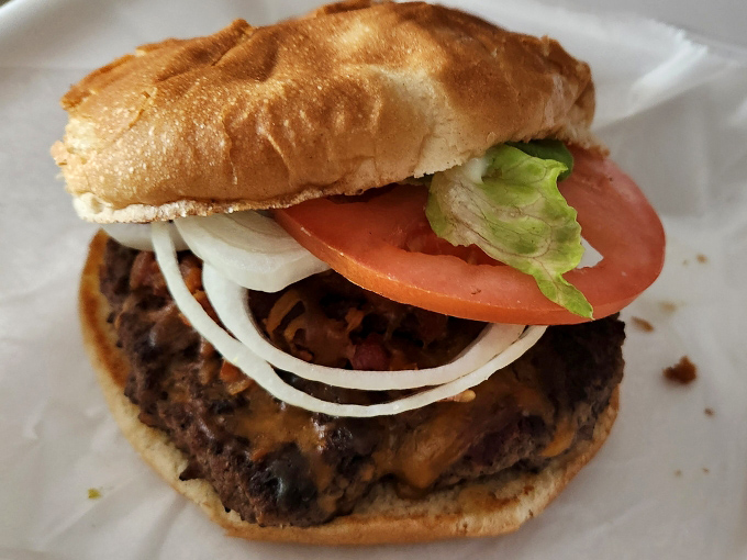 This isn't some fancy gastropub creation – it's the honest burger your taste buds have been searching for, dressed with the classics and ready for business.