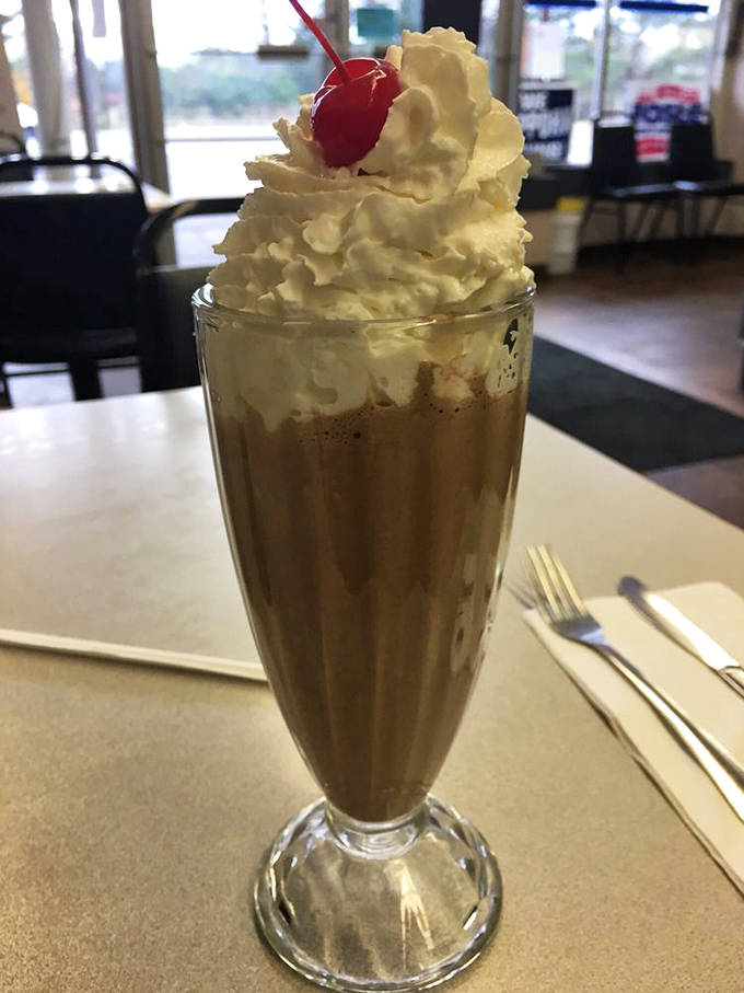 This chocolate milkshake isn't just a beverage&mdash;it's dessert in a glass, crowned with a cloud of whipped cream.