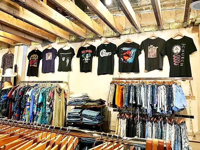 Vintage tees hang like colorful flags of rock history, each one telling stories of concerts long past and bands that defined generations.