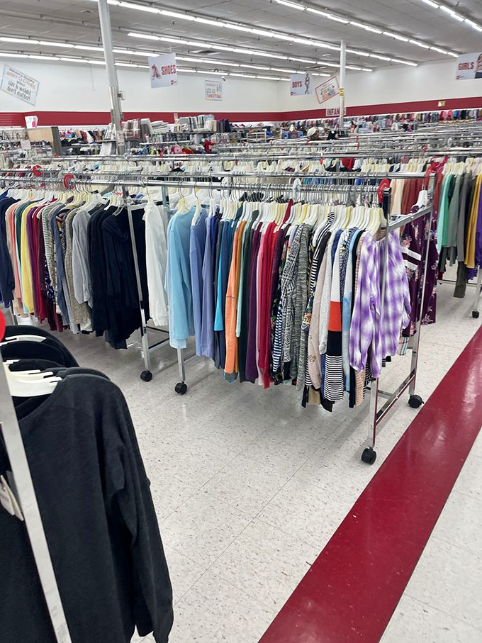 Clothing aisles that stretch into the distance like a fabric-filled horizon, each rack holding someone's former wardrobe waiting for adoption.