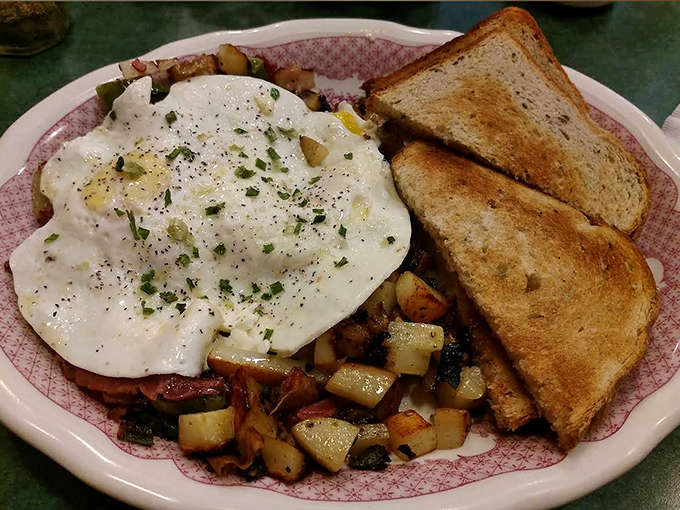 Corned beef hash that would make your grandmother weep with joy, topped with eggs cooked precisely to your specification.