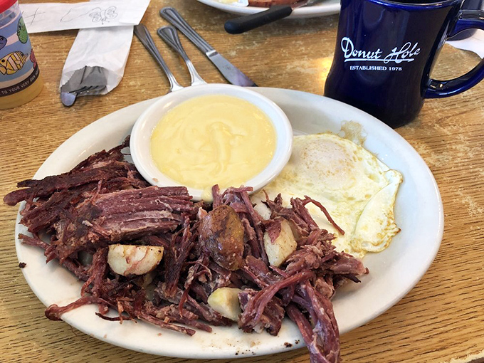 Corned beef hash that puts diner versions to shame, with eggs sunny-side up like they're smiling at your good fortune.
