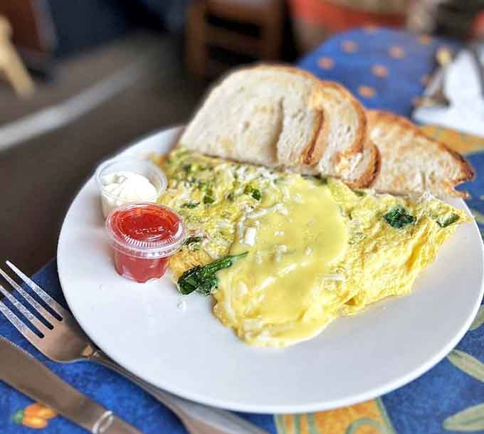 This isn't just breakfast &ndash; it's a morning masterpiece of fluffy eggs, melted cheese and fresh vegetables alongside perfectly toasted bread.