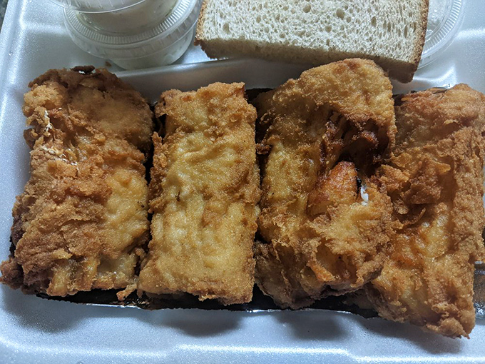 Golden-fried cod fillets showcase the kitchen's expertise &ndash; each piece encased in a light, crispy batter that shatters pleasingly with every bite, revealing moist, flaky fish within.