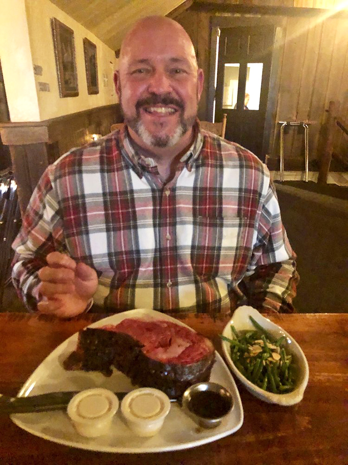 A happy diner contemplates the magnificent steak before him – that look says everything about what's to come.