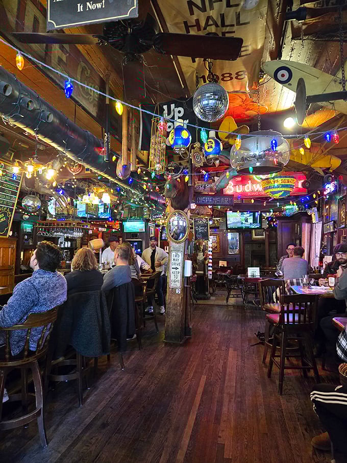 The main bar area buzzes with energy, where vintage memorabilia covers every surface and conversations flow as freely as the drinks.