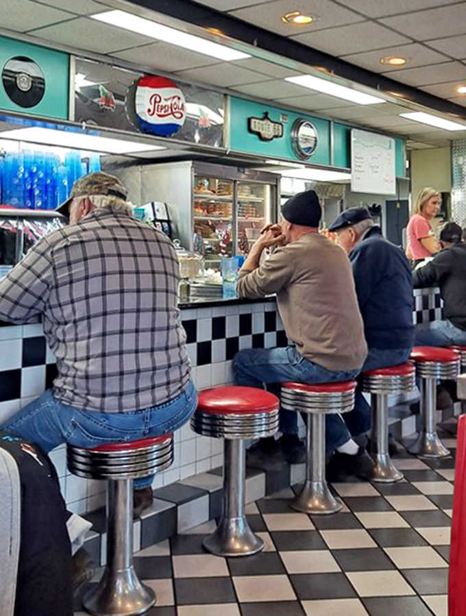 The counter crew and regulars share the easy rapport that comes from years of morning coffees and "the usual" orders.