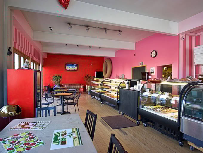 The dining area's vibrant colors and comfortable seating invite guests to linger over their pastries and coffee.