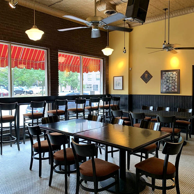 The dining area balances old-world charm with casual comfort, where conversations flow as freely as the coffee.