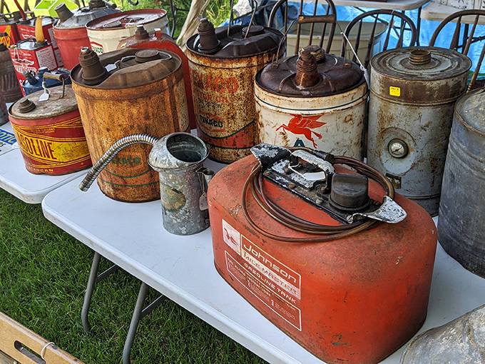 Rusty fuel cans and oil containers showcase industrial design from when gas stations were called "filling stations" and service meant something.