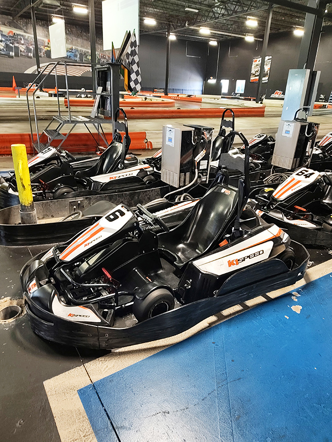 The fleet of Italian-designed electric karts waits in the staging area, each one capable of delivering heart-pounding acceleration and precise handling.