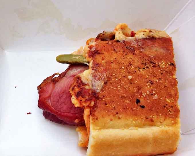 Cross-section perfection reveals the architectural marvel within&mdash;layers of flavor compressed into a handheld vacation to Havana.