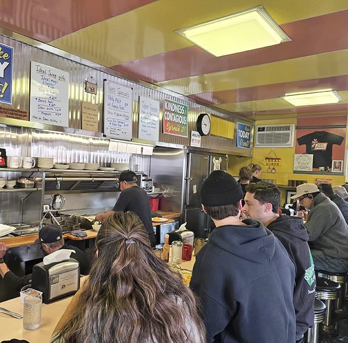 The counter seating isn't just space-efficient&mdash;it's a social experiment where strangers become temporary breakfast companions united by coffee and conversation.