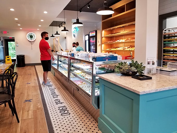 Interior: Clean lines, hexagonal tiles, and warm wood create a space where time slows down &ndash; a sanctuary for those seeking sweet communion.