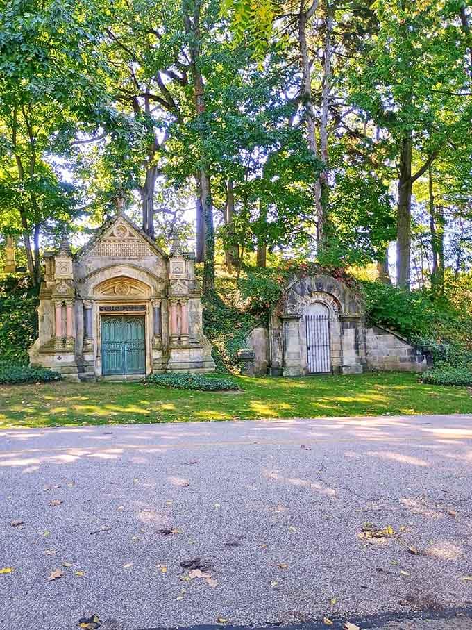 Gothic mausoleums nestle into hillsides like miniature castles, their ornate details showcasing Victorian craftsmanship at its finest.