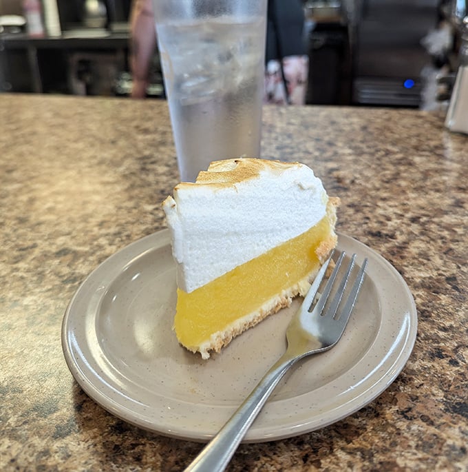 Lemon meringue pie with a mile-high topping &ndash; sunshine on a plate that somehow makes room in an already full stomach.
