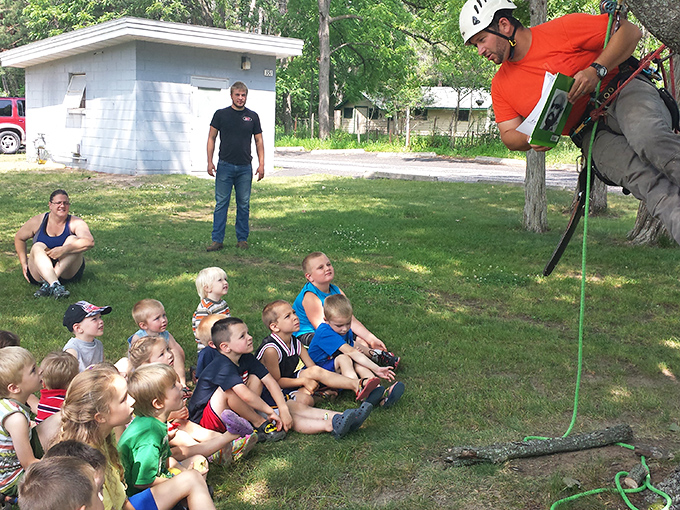 Nothing captures small-town summer like kids gathered for an outdoor demonstration, their faces showing that mix of curiosity and "when's lunch?"