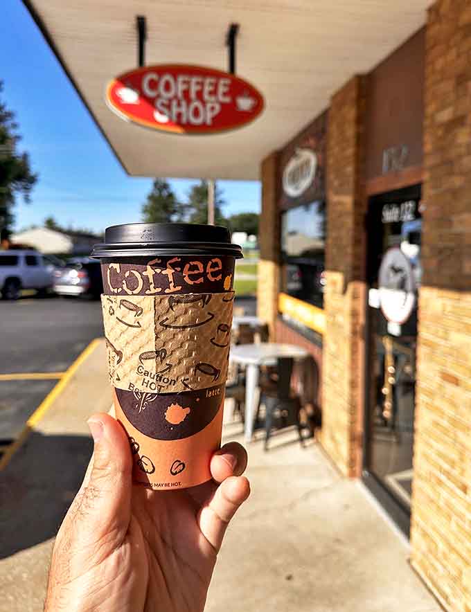 Hot coffee served in a proper to-go cup, ready to fuel your day with the kind of caffeine kick that actually tastes good.