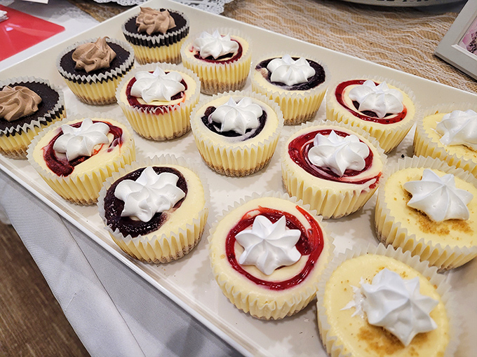 Mini cheesecakes with fruit toppings arranged like edible jewels, each one a perfect two-bite indulgence.