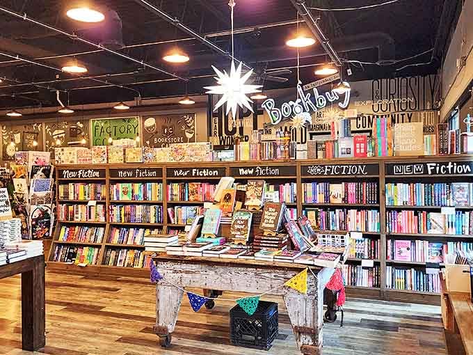 The carefully arranged display table showcases new releases like literary treasures, with that distinctive star-shaped pendant light casting a warm glow overhead.