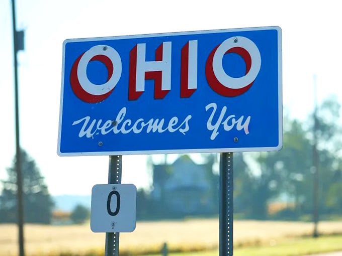 This sign doesn't just mark a border, it marks the beginning of countless wonderful discoveries.