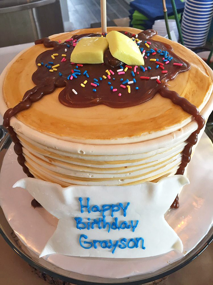 A birthday cake disguised as a stack of pancakes complete with "syrup" and butter &ndash; dessert inception that's as clever as it is delicious.