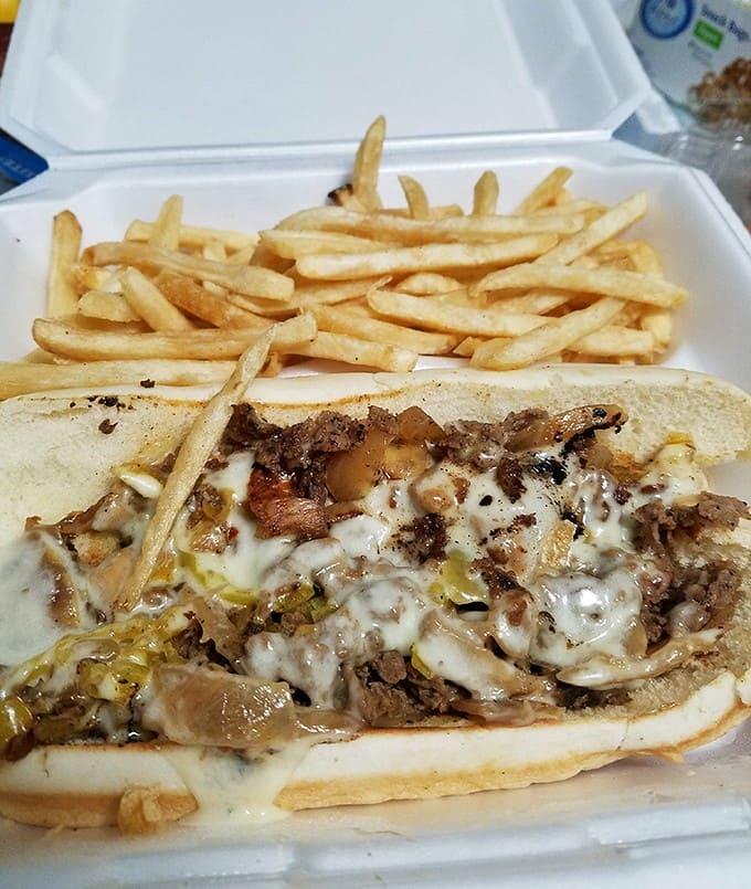 That Philly cheesesteak is loaded with more cheese and meat than should legally be allowed on one sandwich.