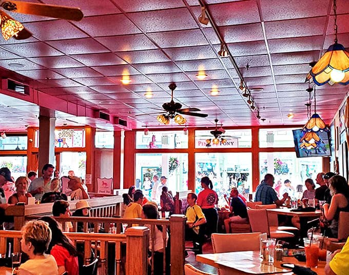 Happy diners fill the Pink Pony's dining room, where stained glass lamps cast a warm glow over conversations and island memories.